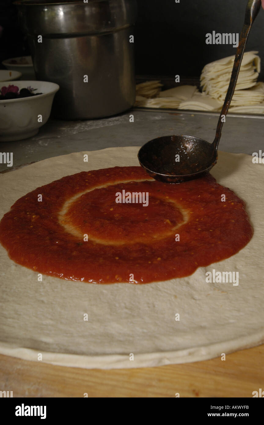 Preparation of a pizza Stock Photo - Alamy