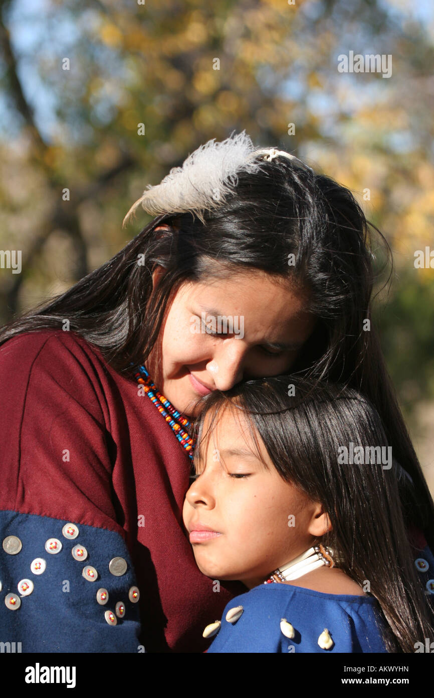 A Native American Indian woman hugging a child Stock Photo - Alamy