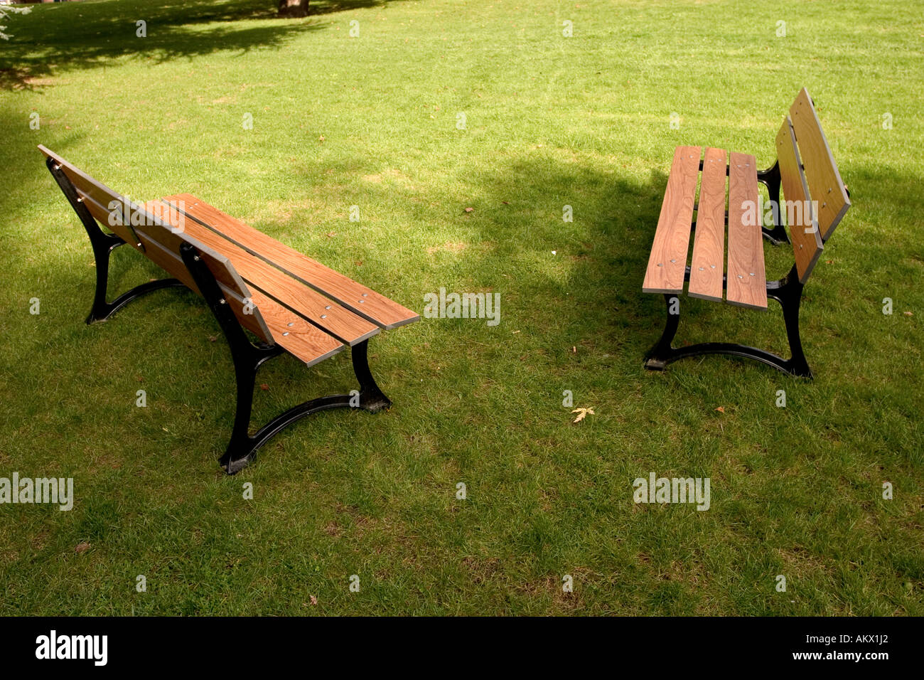 2 two benchs in a park Stock Photo - Alamy