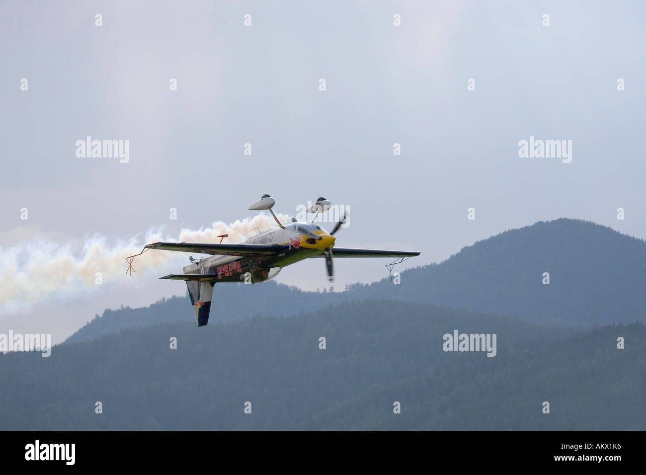 Airplane model Zivko Edge 540 flies upside down in a stunt flying show ...