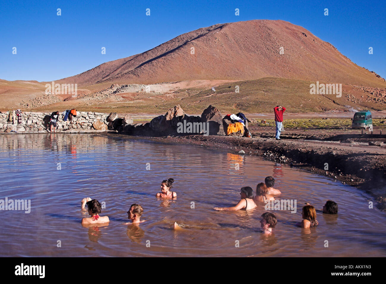 People bathing at the Tatio geyser, Atacama desert, northern Chile ...