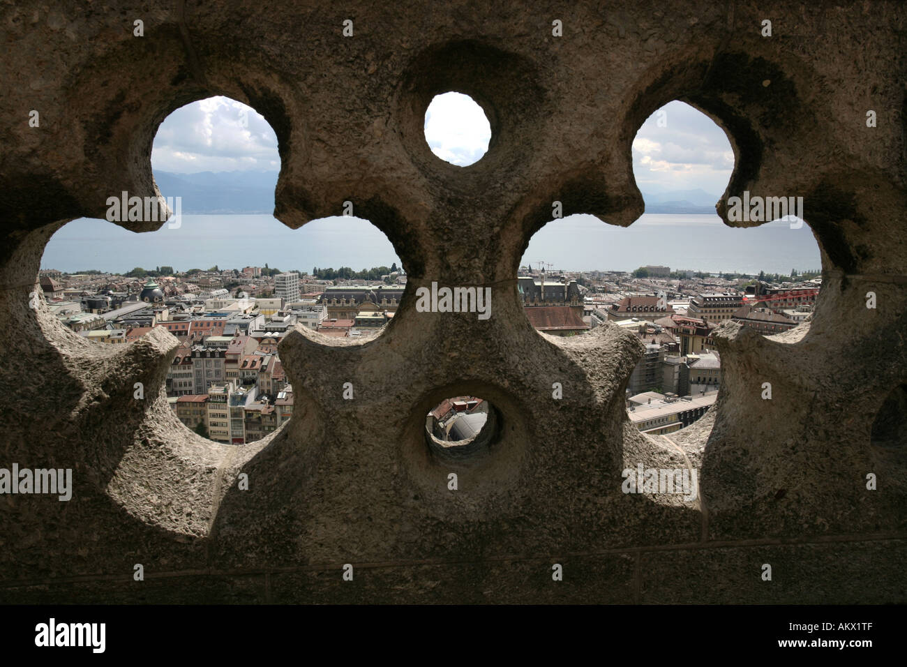 View through the balustrade to the roofs of Lausanne downtown. Tower on ...