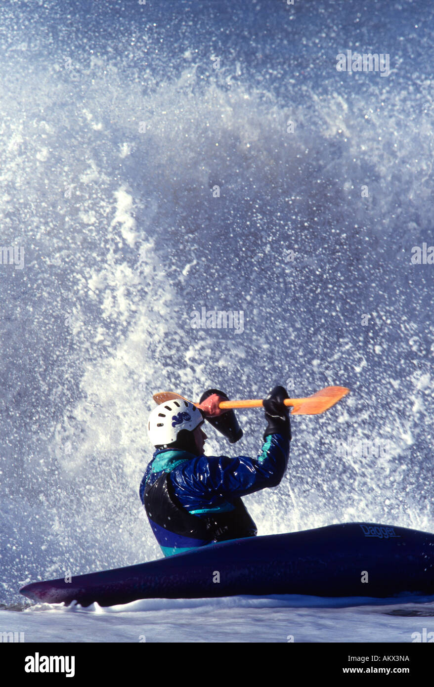 Whitewater kayaker bracing to be hit by wave Stock Photo - Alamy