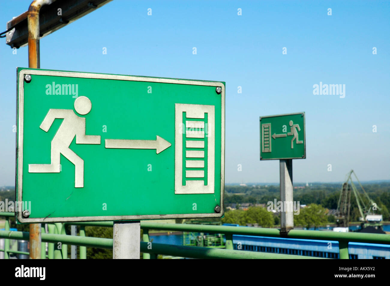 Green sign: escape route over the ladder Stock Photo - Alamy