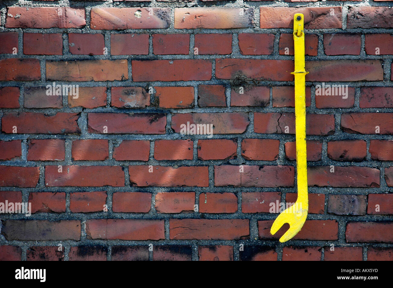 Yellow lever on brick wall Stock Photo - Alamy