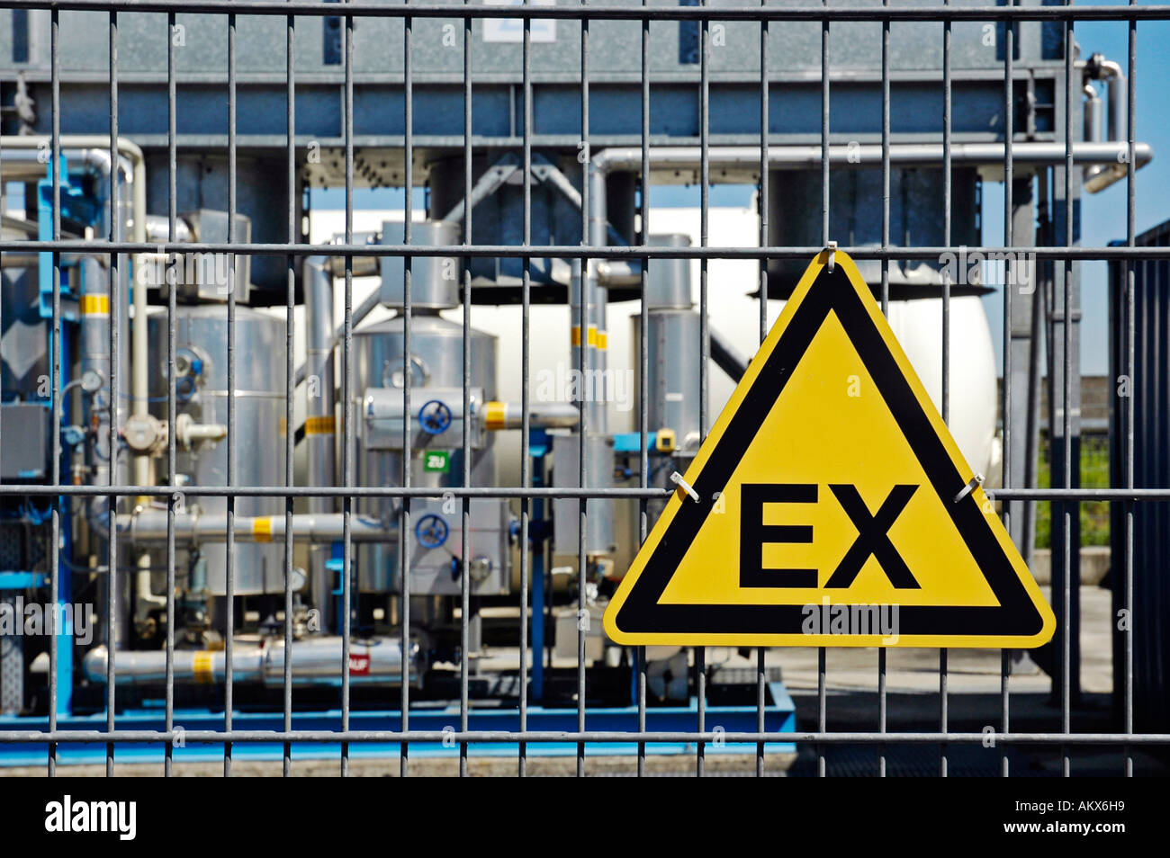Yellow sign: danger of explosions Stock Photo - Alamy