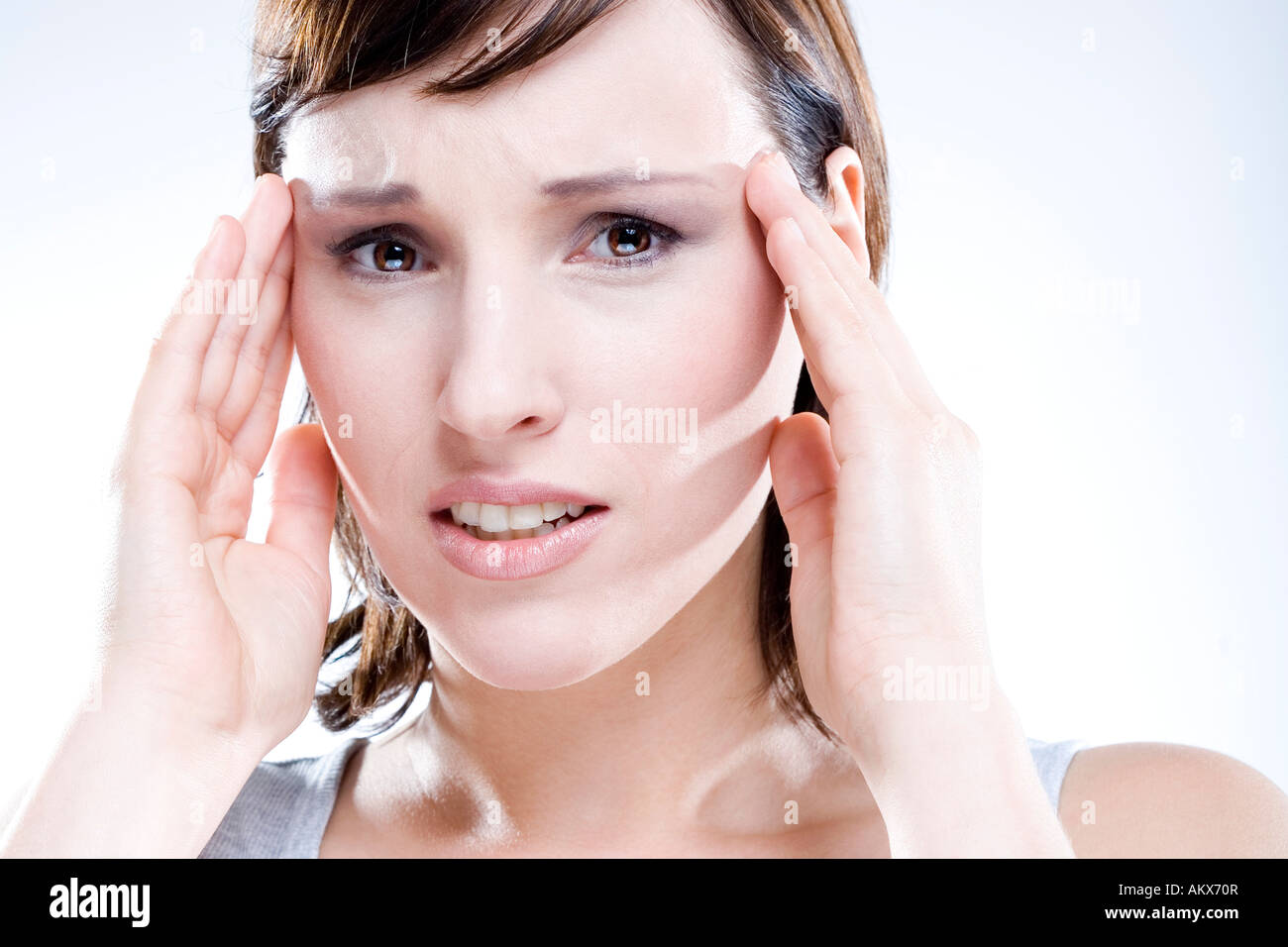 Woman, hands on head, portrait Stock Photo - Alamy