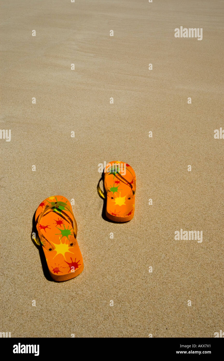 Flip-flops on the beach Stock Photo - Alamy