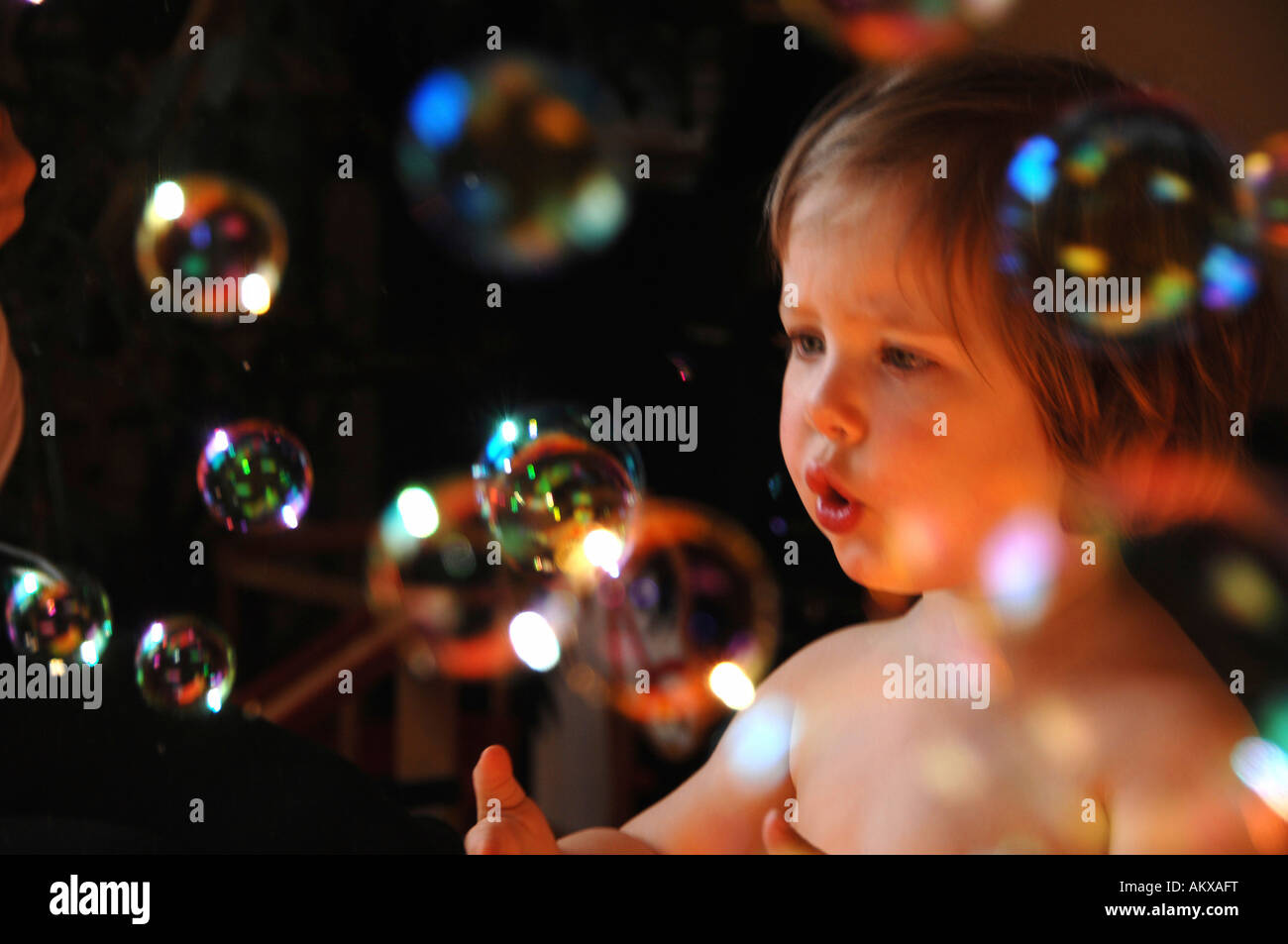 Kid plays with bubbles hi-res stock photography and images - Alamy