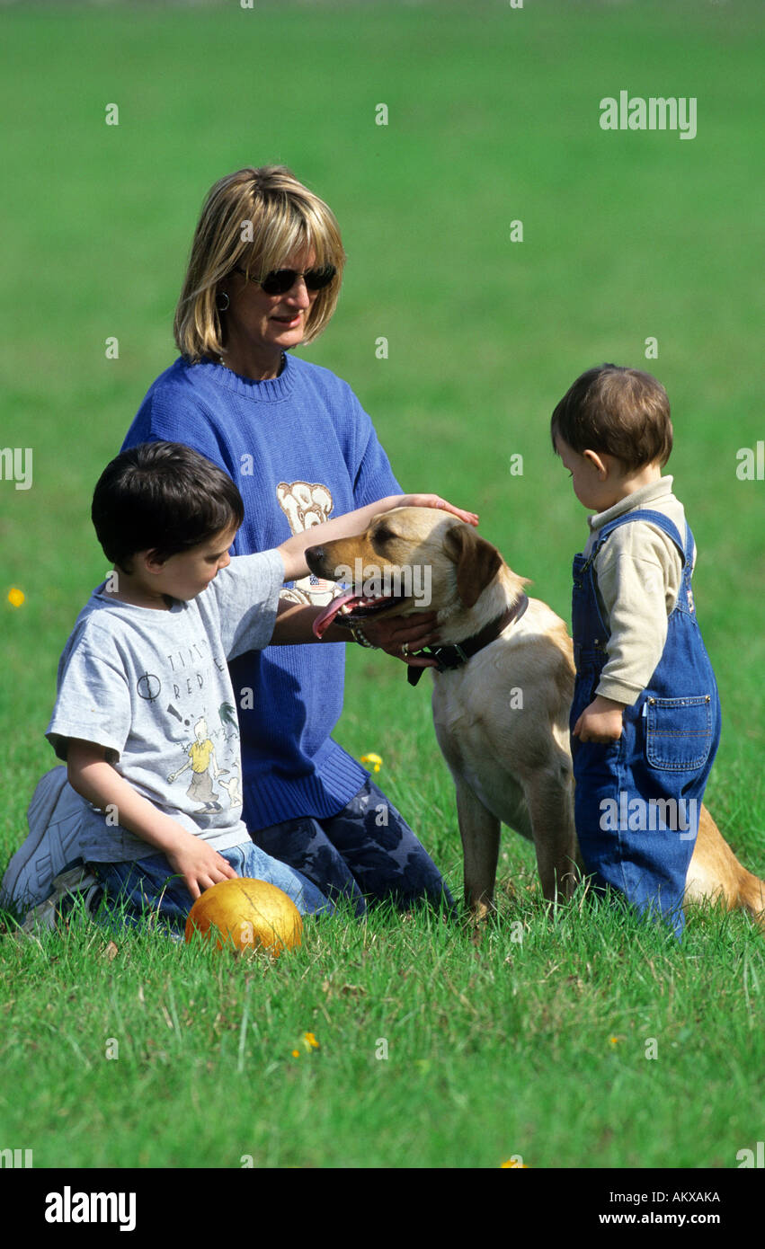 Mother child and dog Stock Photo - Alamy