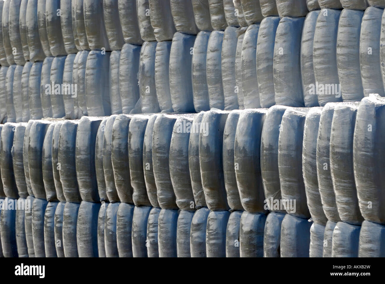Stacked silage bales wrapped in plastic for a rural biomass gasifier ...