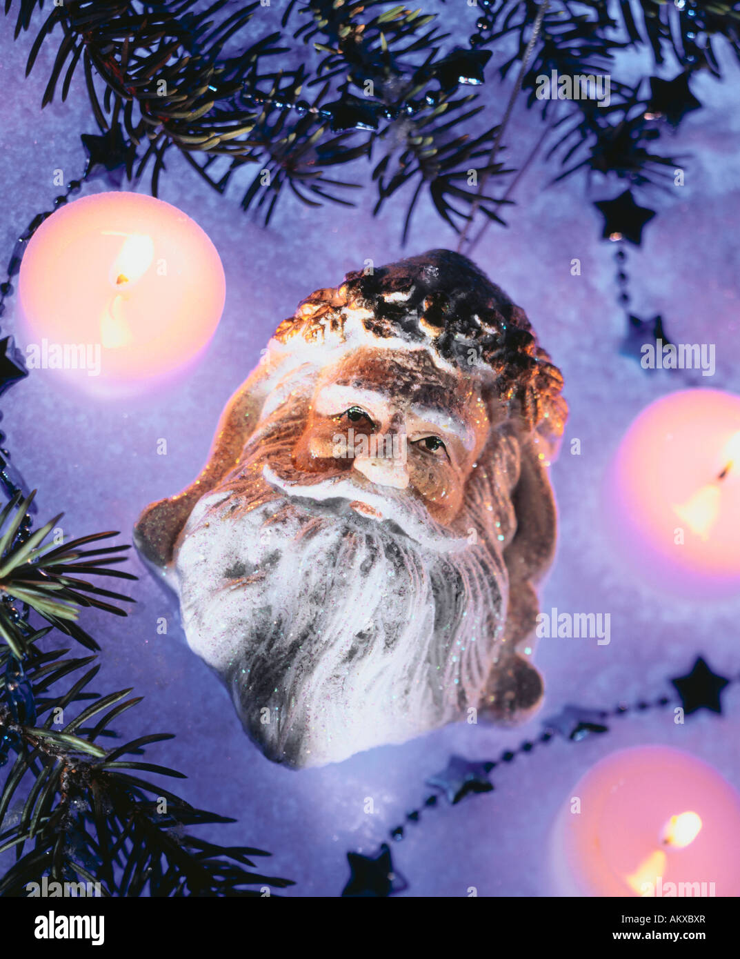 Burning candles, christmas tree decoration, Santa Claus Stock Photo - Alamy