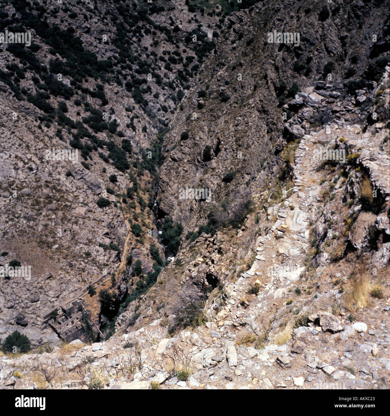 Ancient mule mine trail down into Rio Trevelez gorge with ruined ...