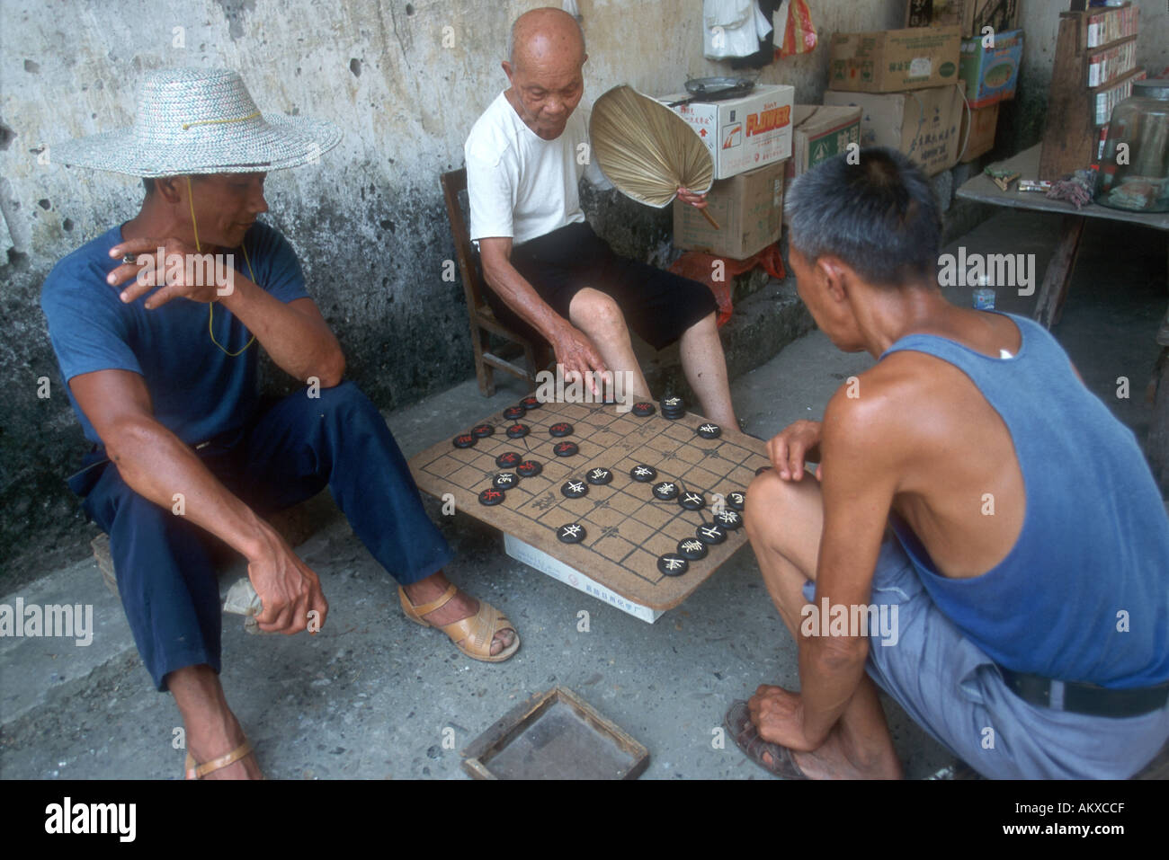 Chinese men playing a board game Yangshuo China Stock Photo - Alamy