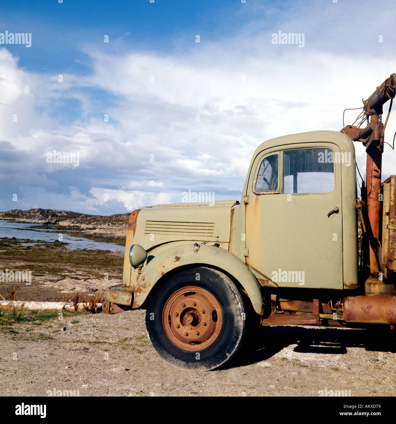 Abandoned vintage 1950s Mercedes truck lorry with rocky shoreline in ...