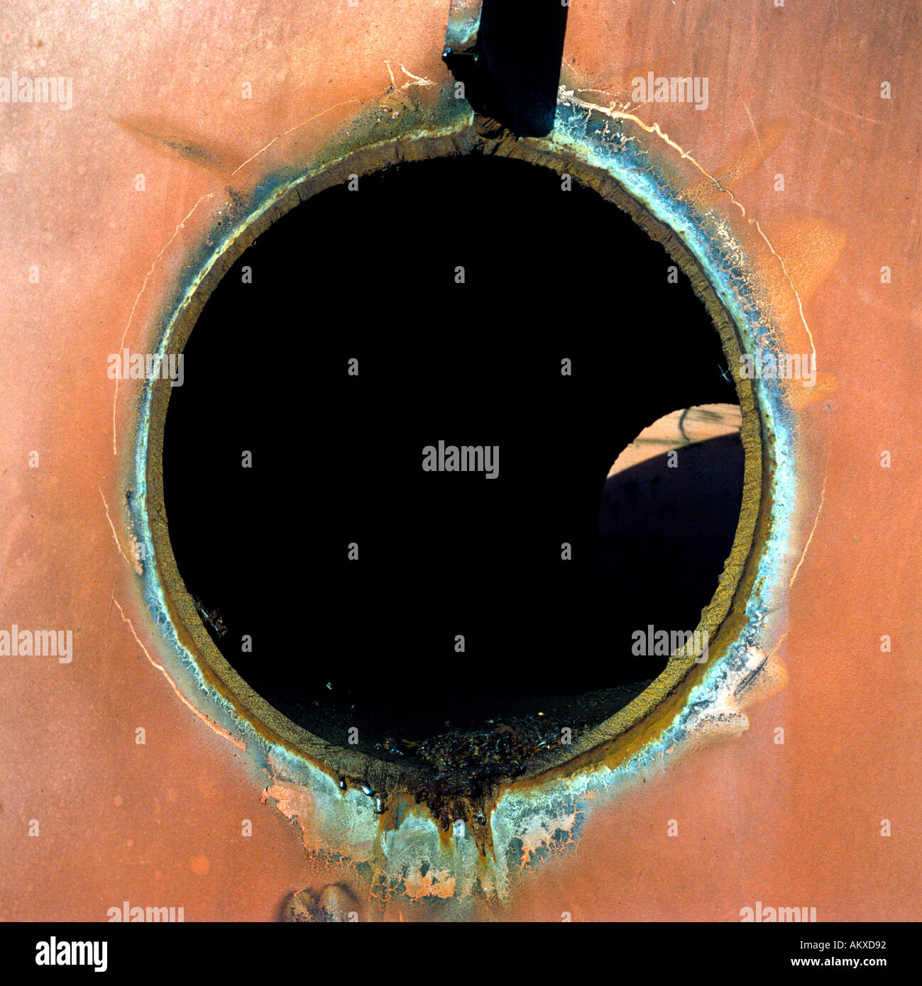 Detail of scrap metal orange painted pipeline buoy with rust marine ...