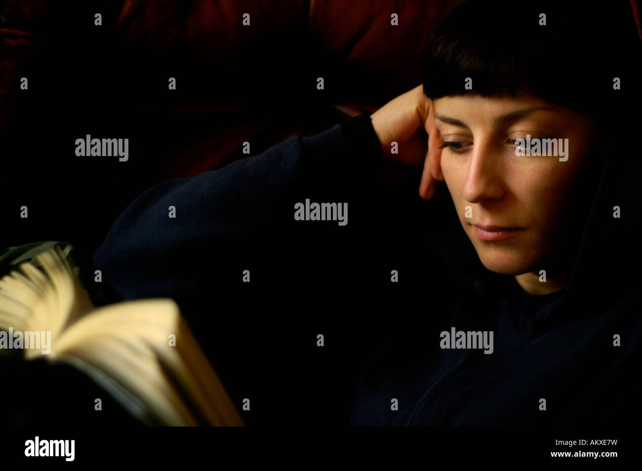 lonely woman is reading a book Stock Photo - Alamy