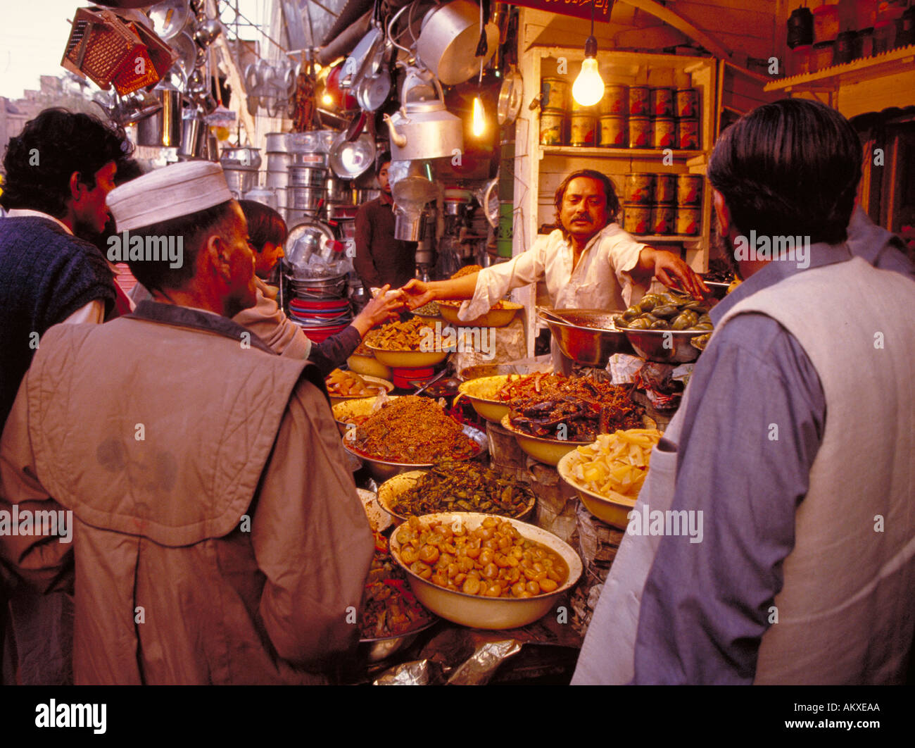 Karachi, Pakistan a man sells a variety of foods to shoppers in an open ...