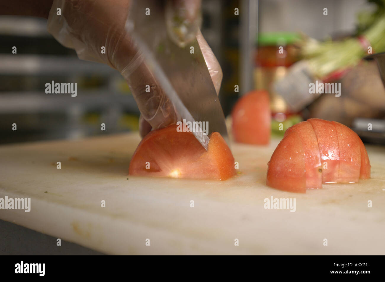 A chefs hands dicing up a tomato Stock Photo - Alamy