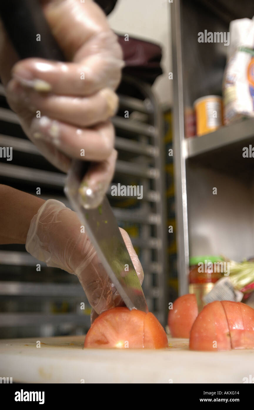A chefs hands dicing up a tomato Stock Photo - Alamy