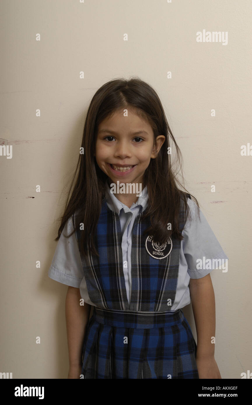 A portrait of a young, Hispanic girl in a school uniform Stock Photo ...