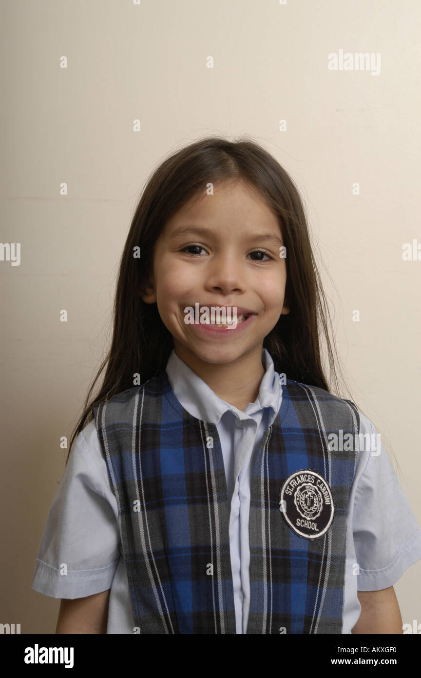 A portrait of a young, Hispanic girl in a school uniform Stock Photo ...