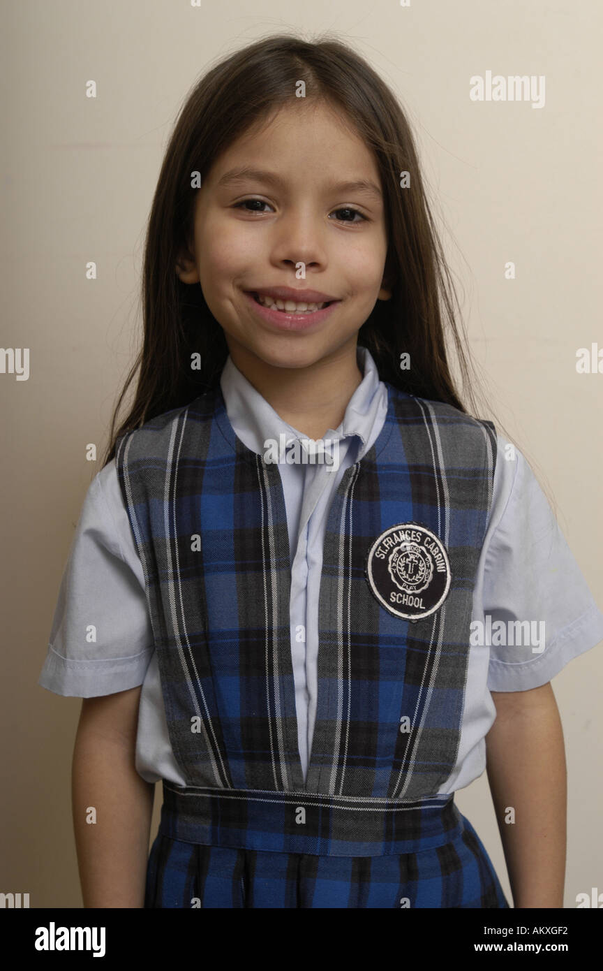 A portrait of a young, Hispanic girl in a school uniform Stock Photo ...
