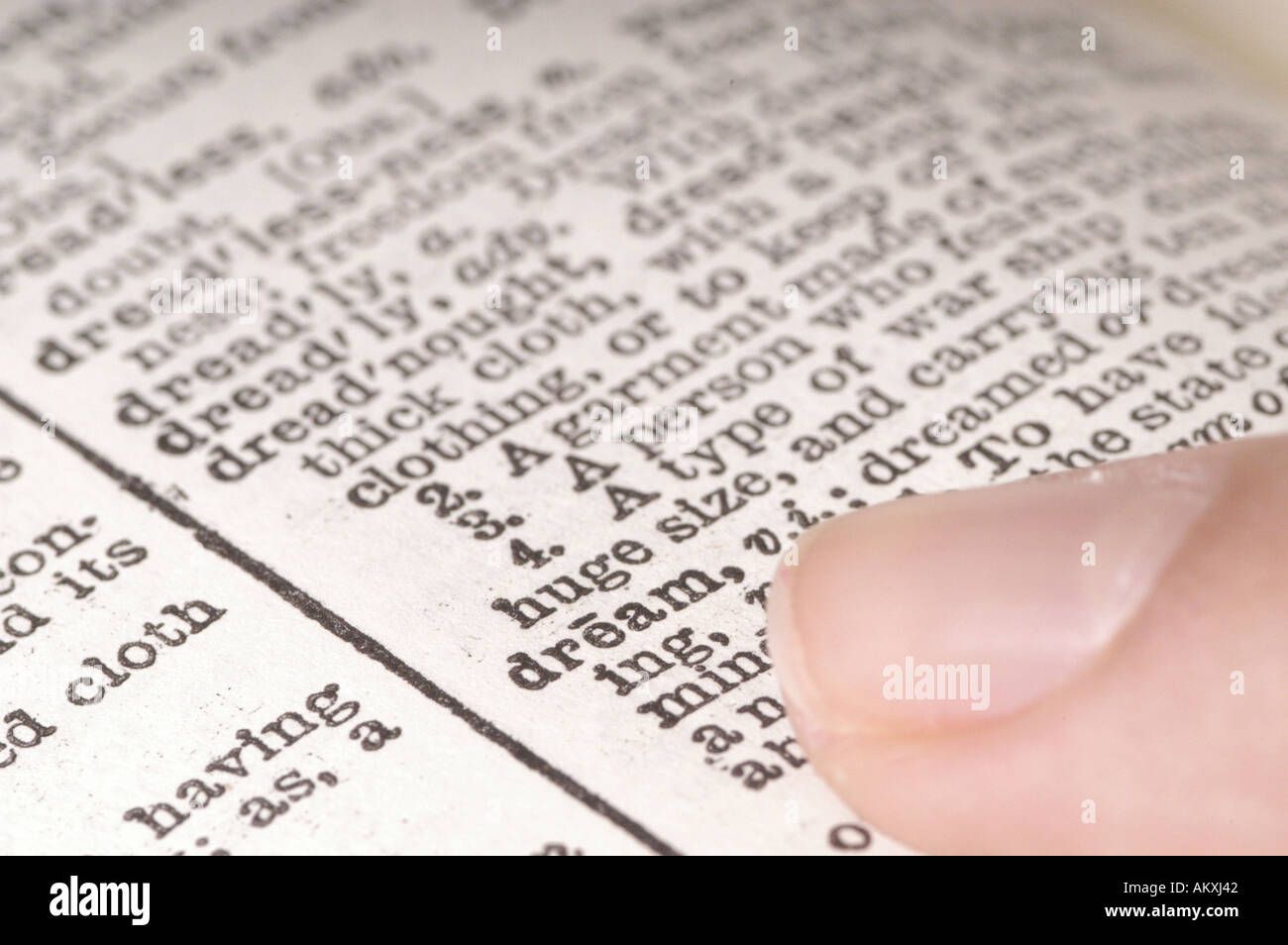 Finger pointing word in dictionary hi-res stock photography and images ...