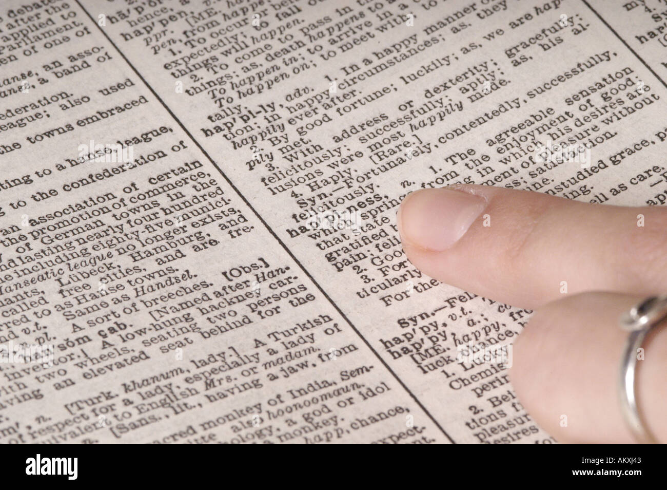 Finger pointing word in dictionary hi-res stock photography and images ...