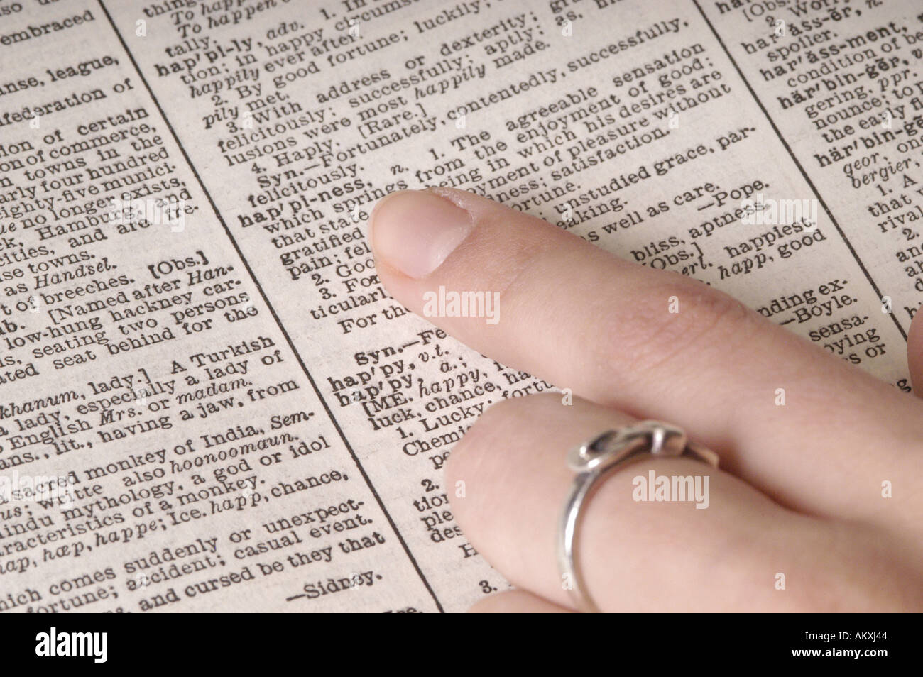 Finger pointing word in dictionary hi-res stock photography and images ...