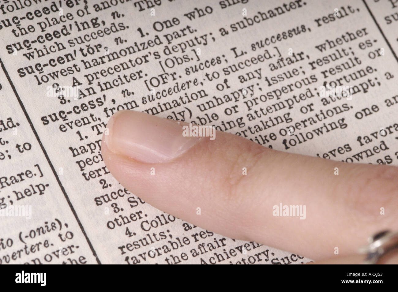 Finger pointing word in dictionary hi-res stock photography and images ...