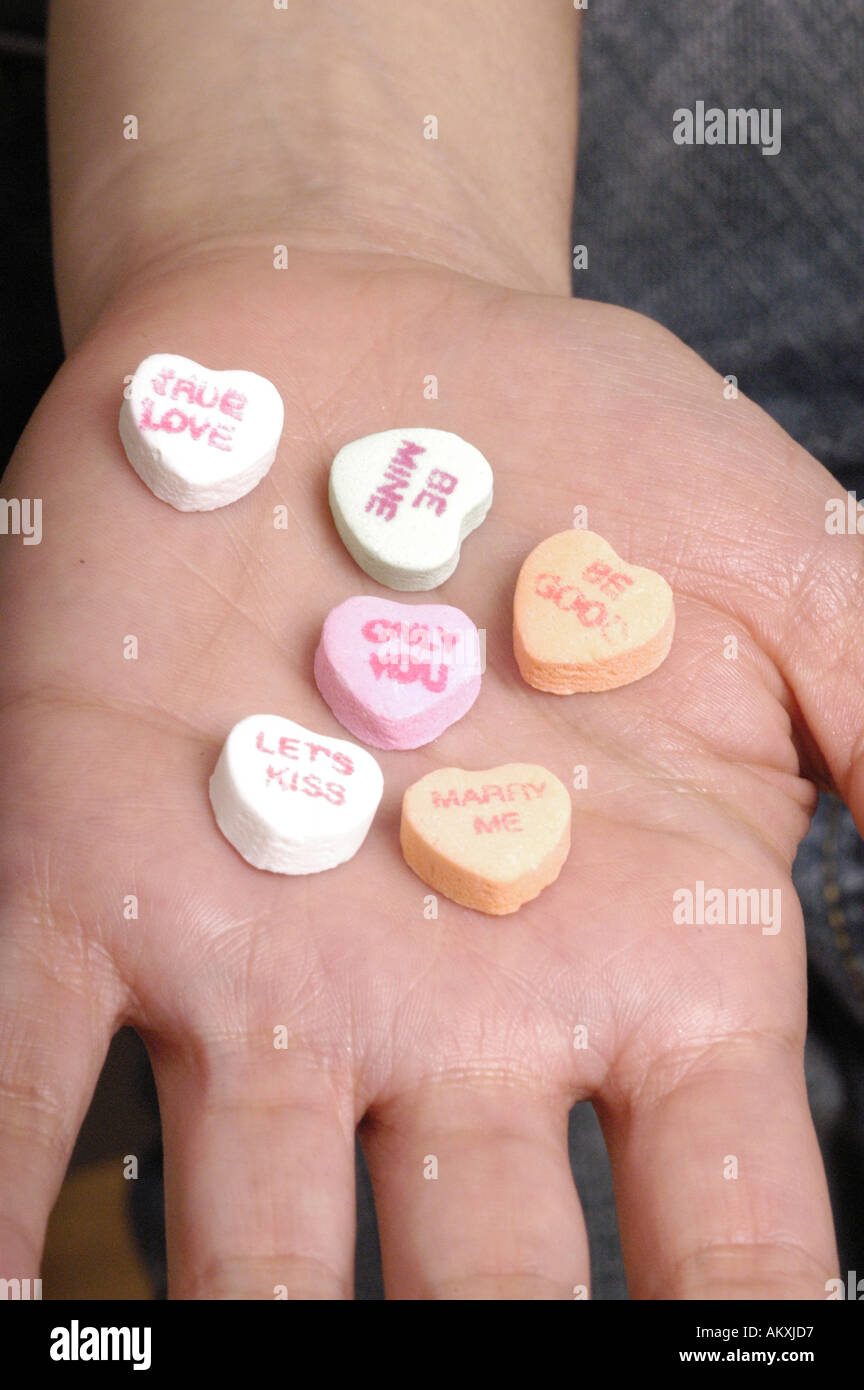 Hand holding out heart candy hi-res stock photography and images - Alamy
