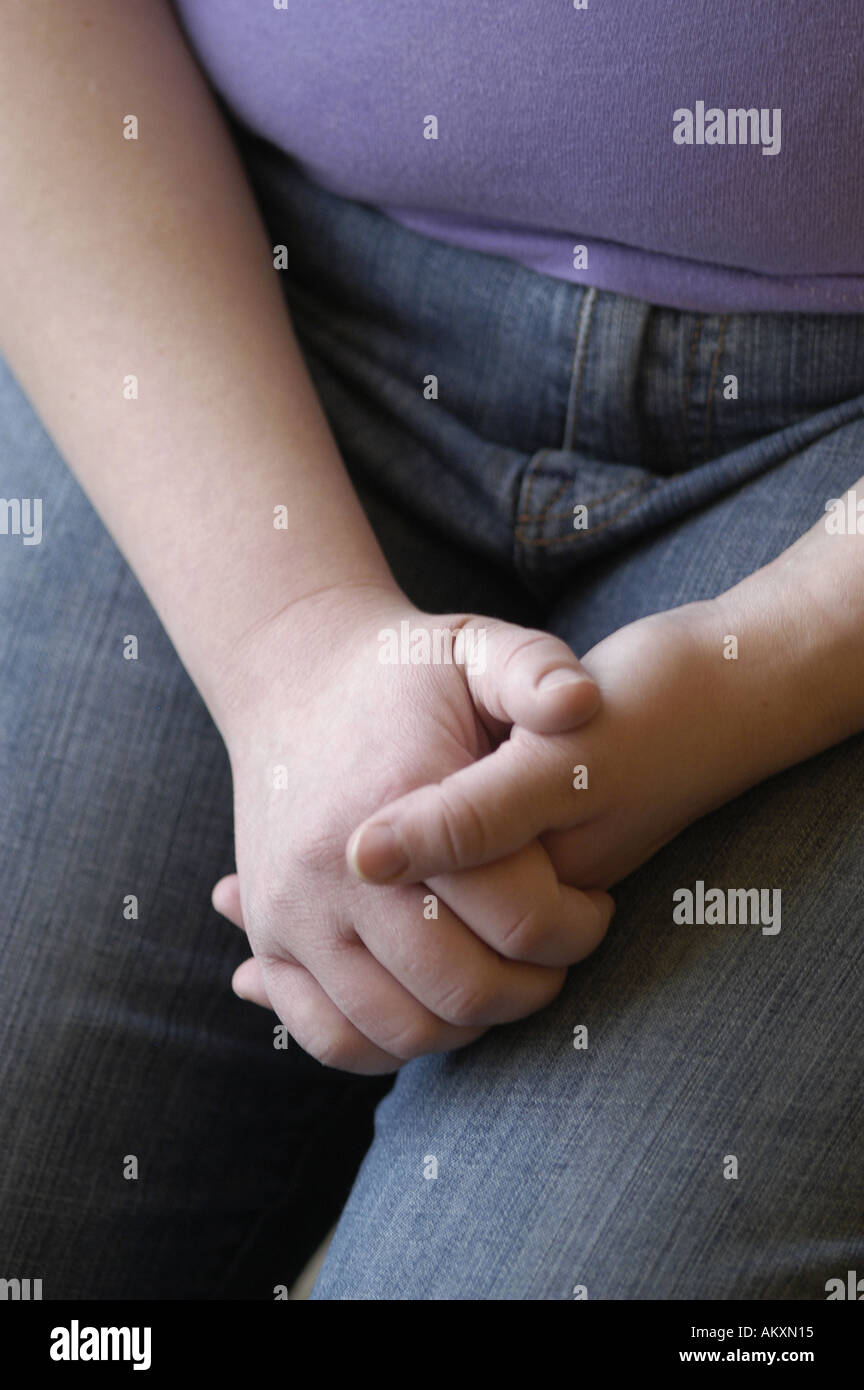 A person's folded hands Stock Photo - Alamy