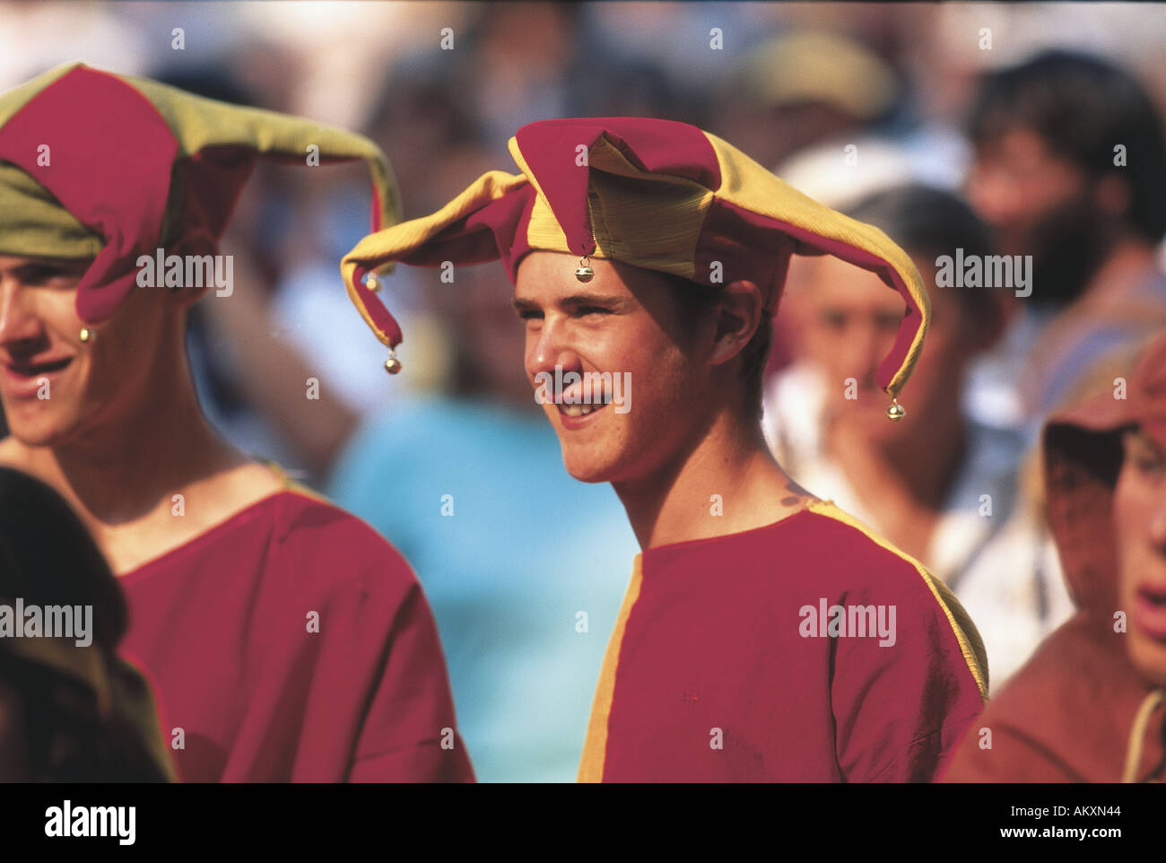 Boys in jester hats enjoying the fun and games of the Medieval Festival ...