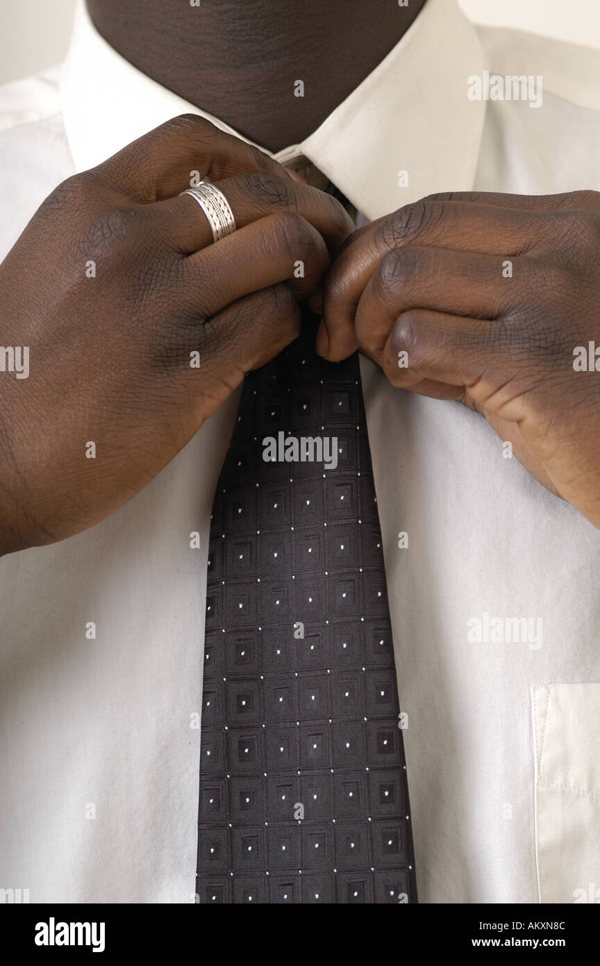 A set of hands buttoning clothing Stock Photo - Alamy