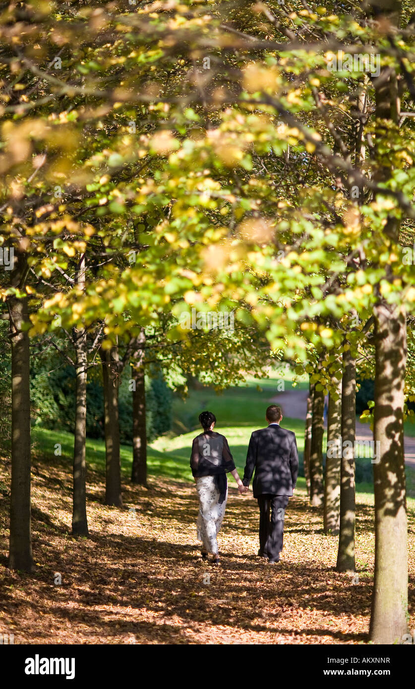 Couple having a walk in the forest, autumnal walk Stock Photo - Alamy