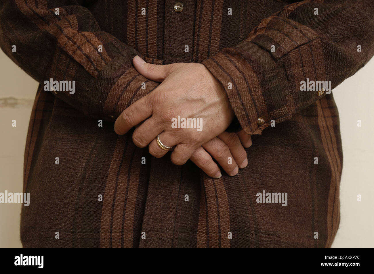 A person's folded hands Stock Photo - Alamy