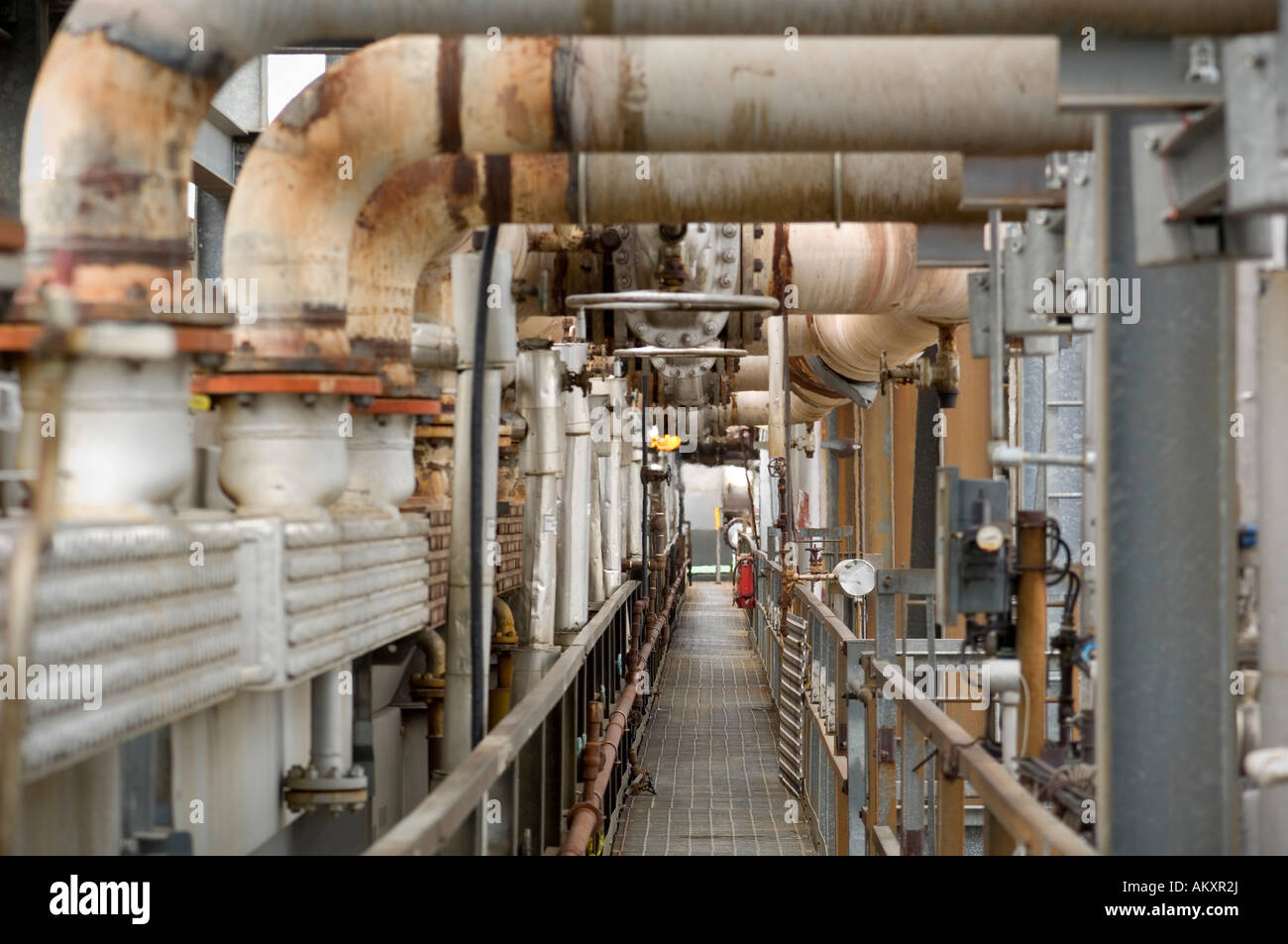Walkway surrounded by piping Stock Photo - Alamy