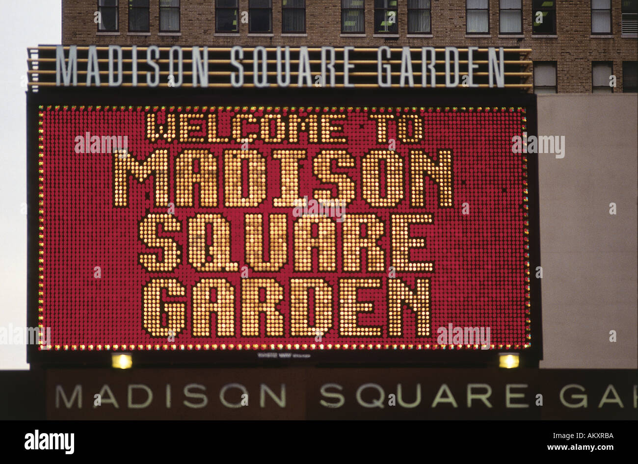 A large red sign with gold letters welcomes people to Madison Square ...