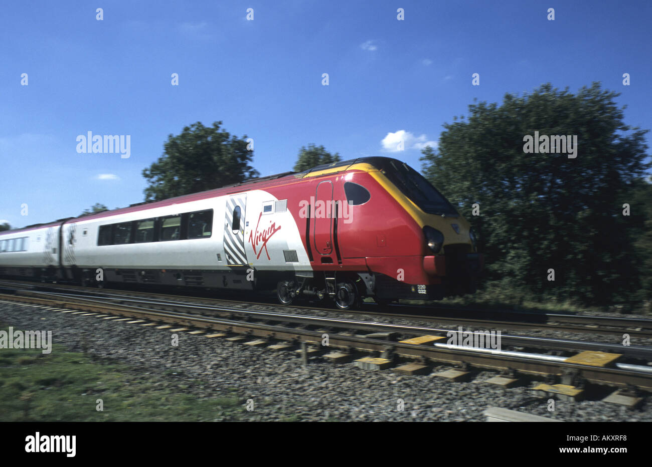 Virgin Voyager train at speed, Warwickshire, England, UK Stock Photo ...