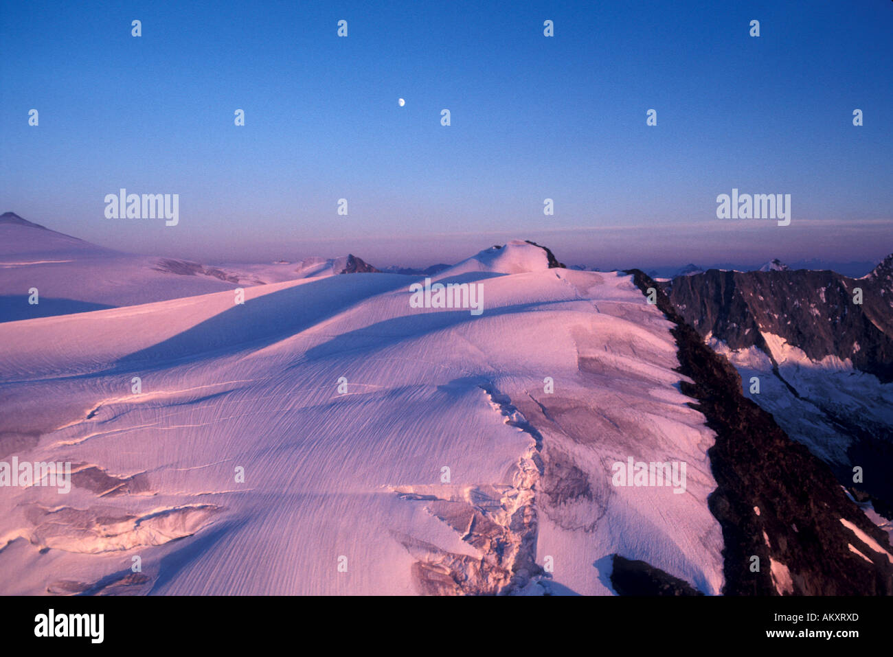 mountain twilight moon rising rise moonrise purple sky snow tranquil ...