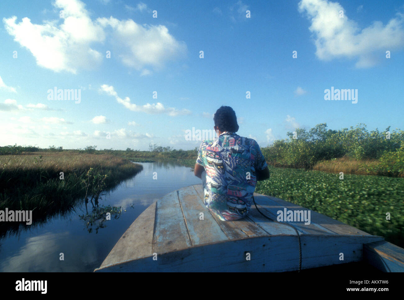 Nicaragua Miskito Coast indian boy on canoe bow Stock Photo - Alamy