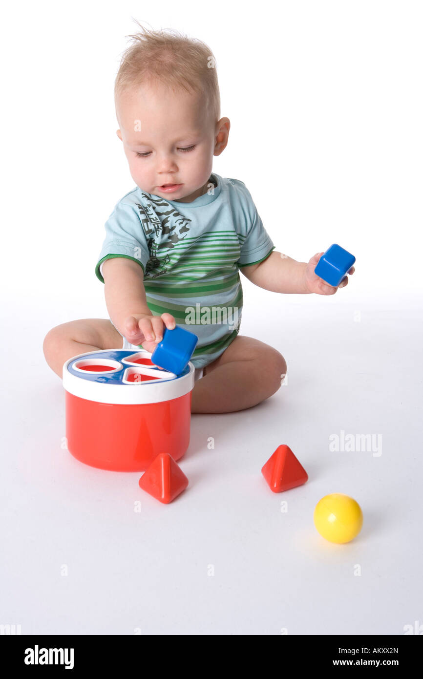 Baby boy playing with bricks Stock Photo - Alamy