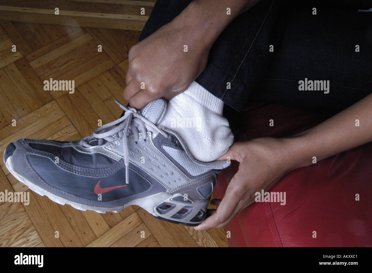 A close-up of a person putting on sneakers Stock Photo - Alamy