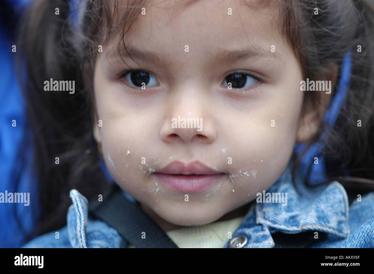 A portrait of a young girl with crumbs on her face Stock Photo - Alamy
