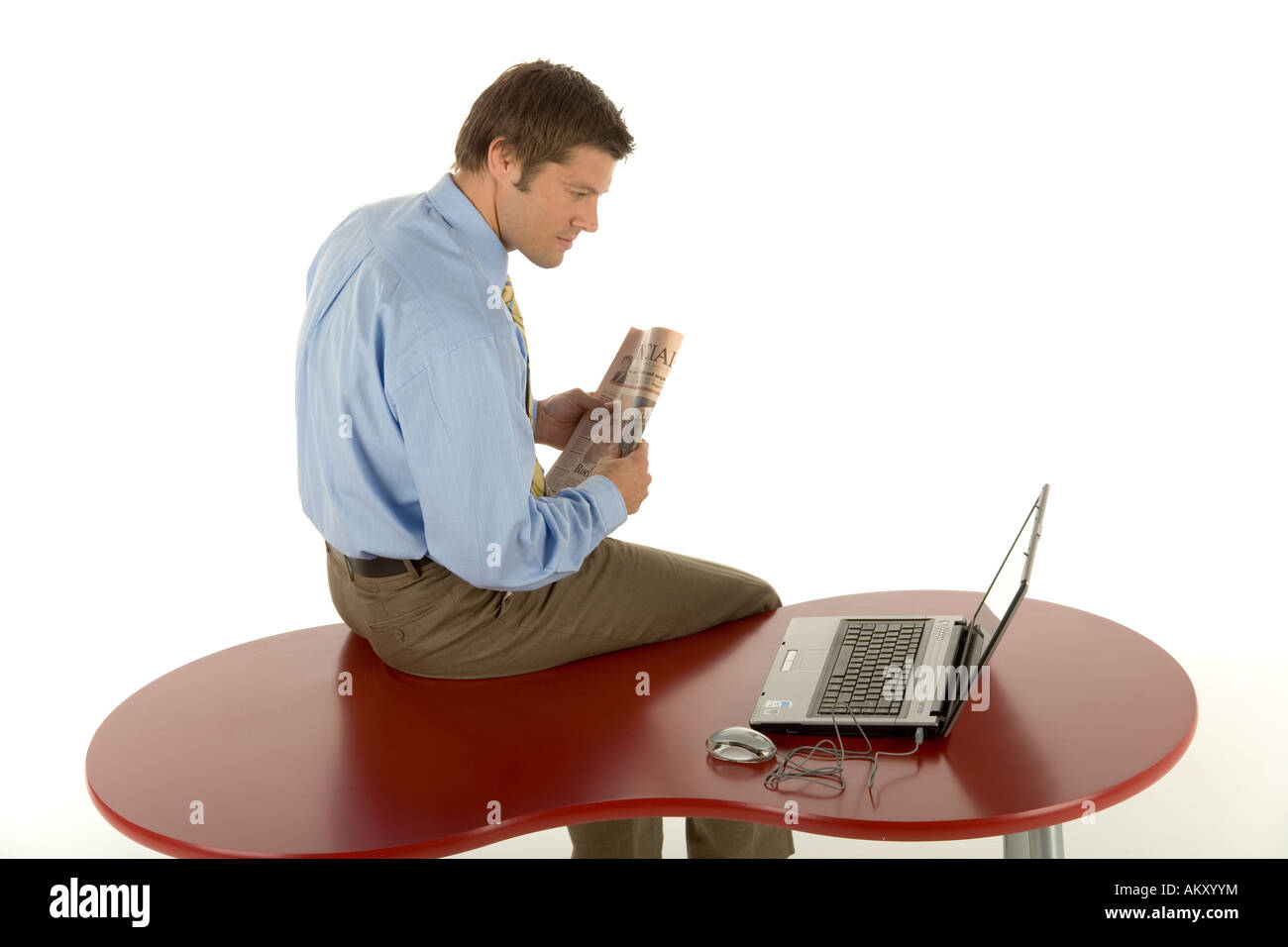 Young business man working on a laptop computer in an office ...