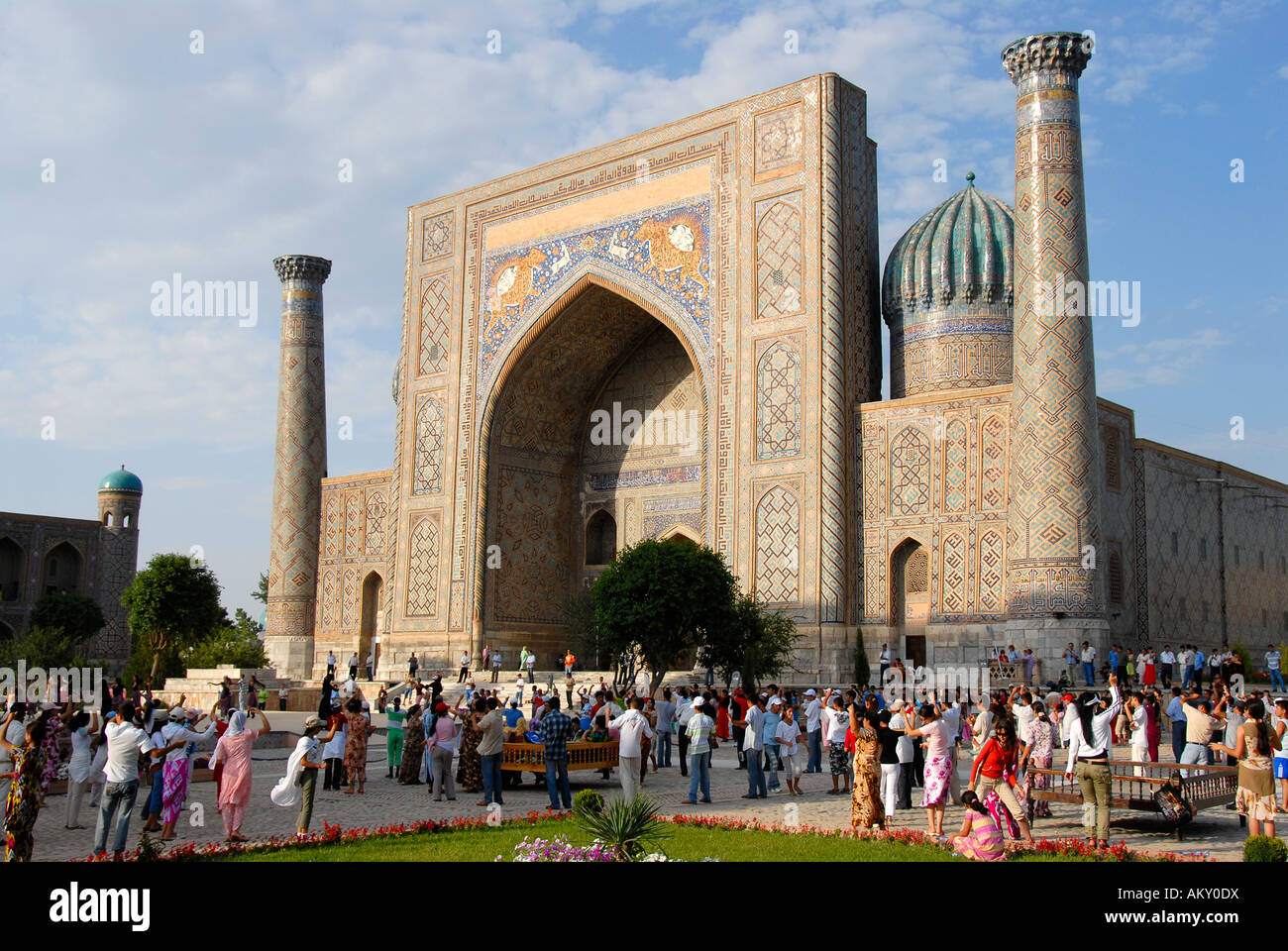 People dancing at Madrasah Sherdar Registan Samarkand Uzbekistan Stock ...