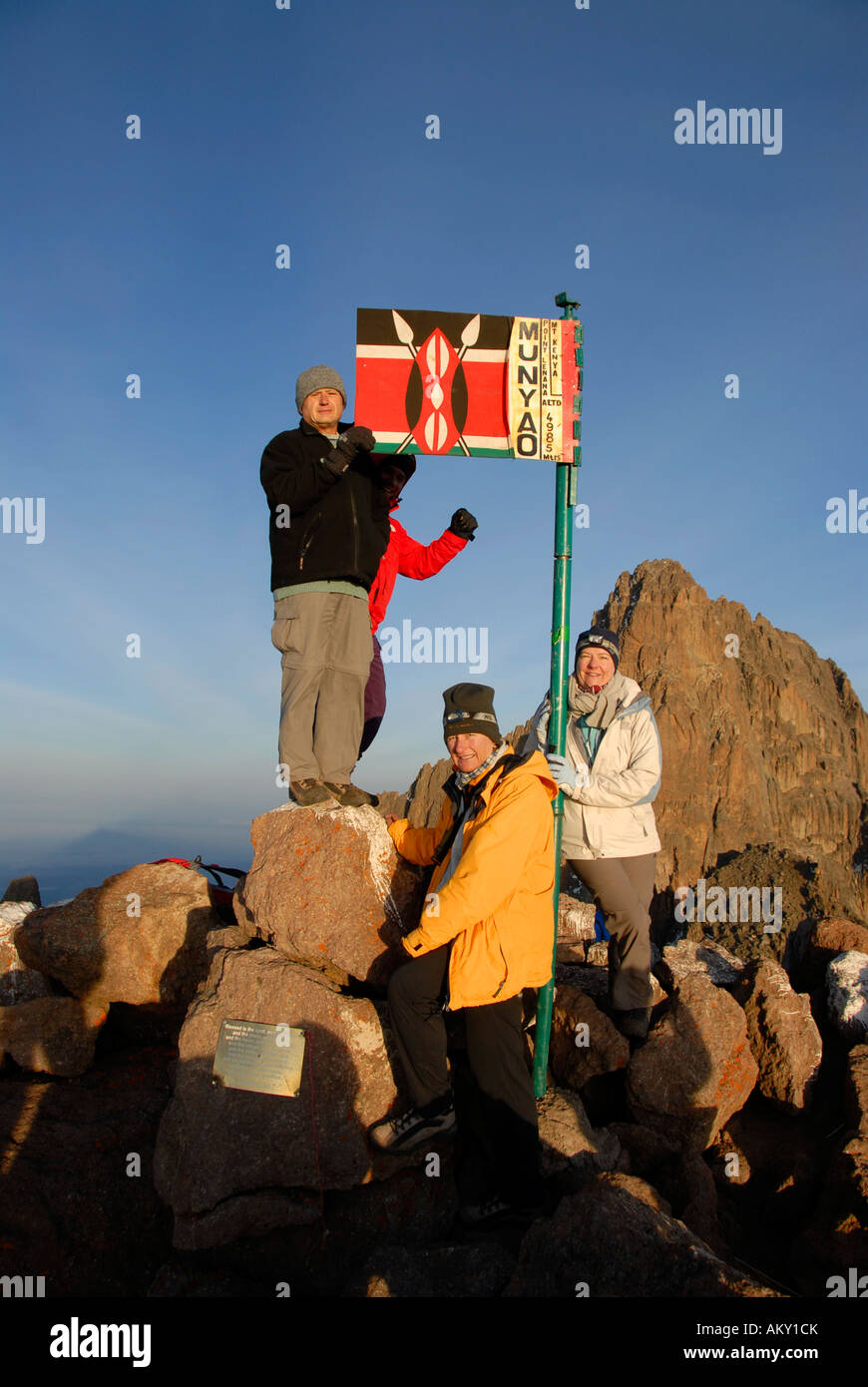 Group of mountaineerers at summit Point Lenana (4985 m) with Batian ...