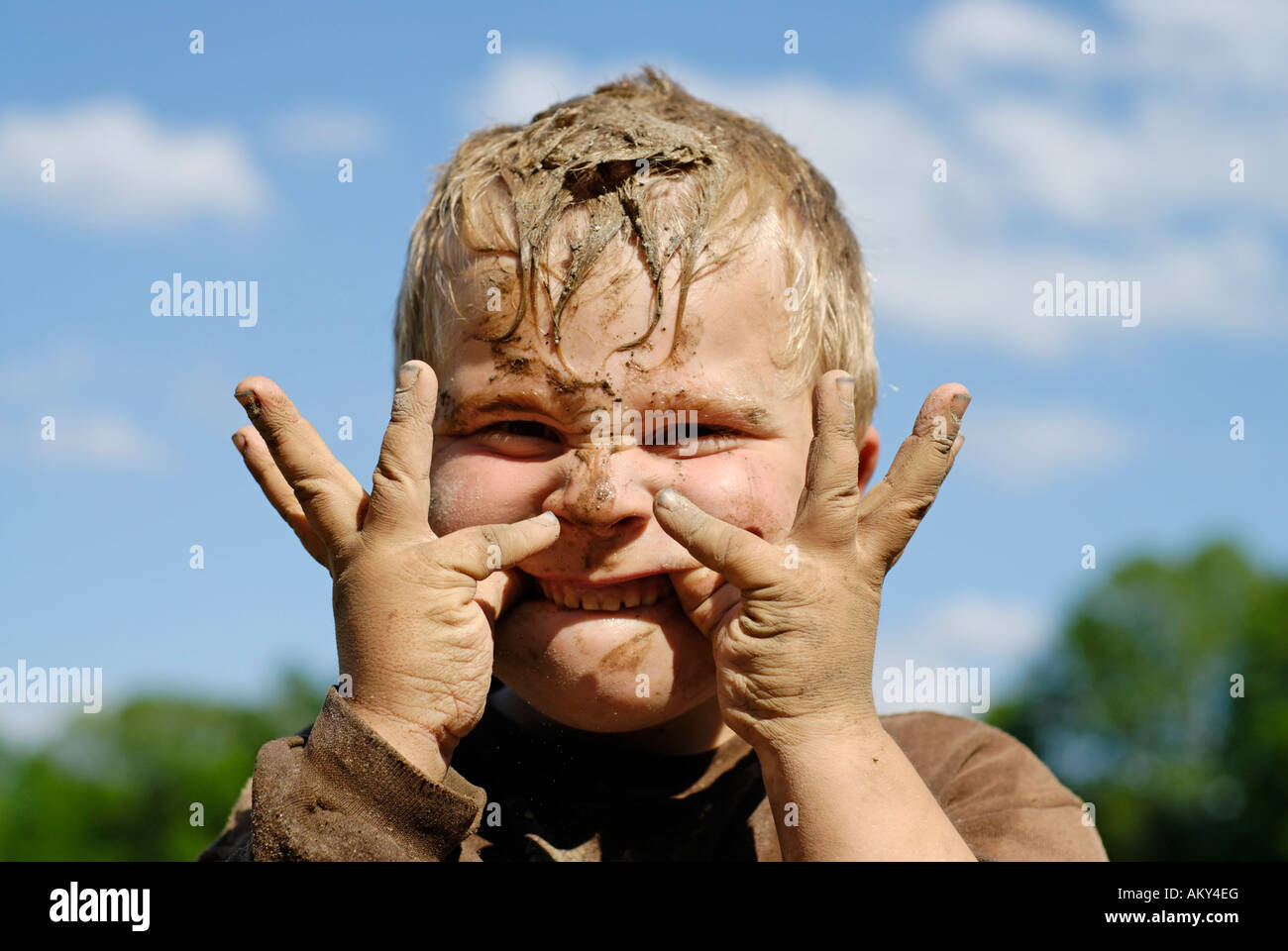 Boy covered with mud Stock Photo - Alamy