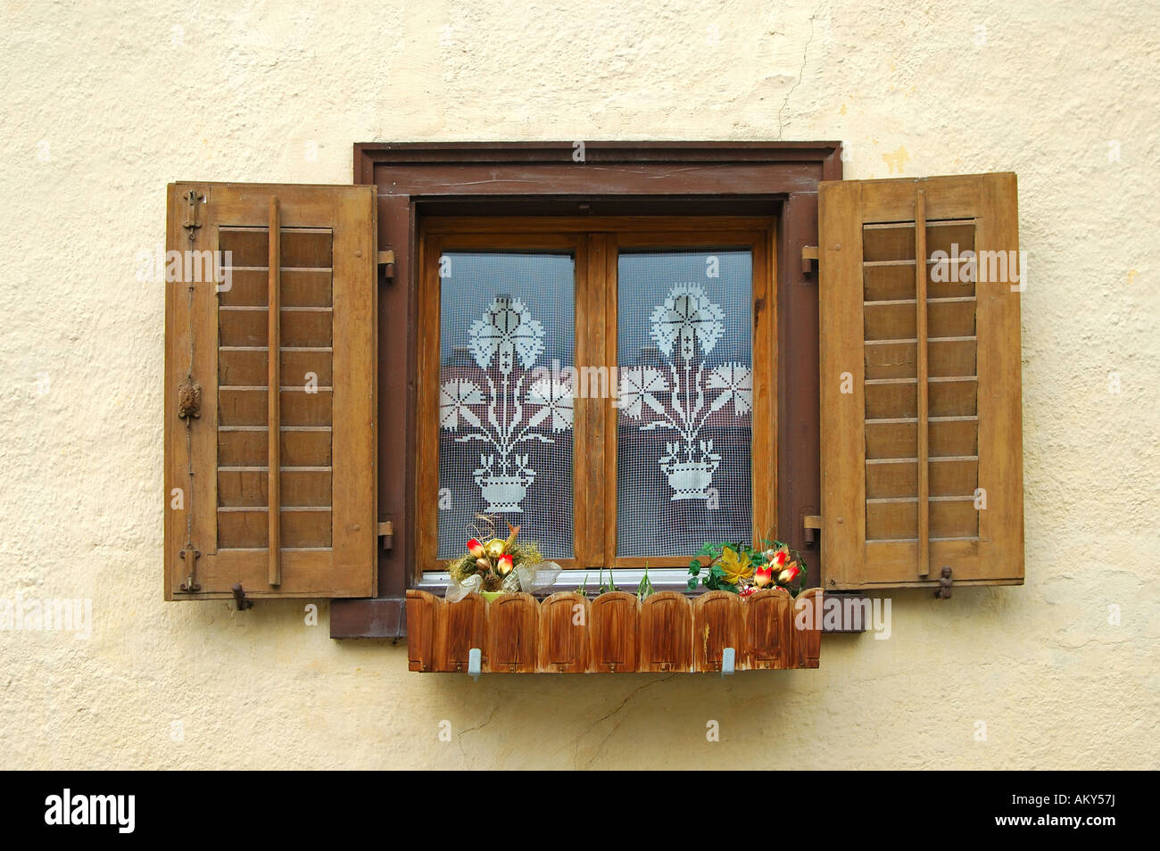 Window with lace curtain of a typical Engadine house, Scuol, Engadin ...